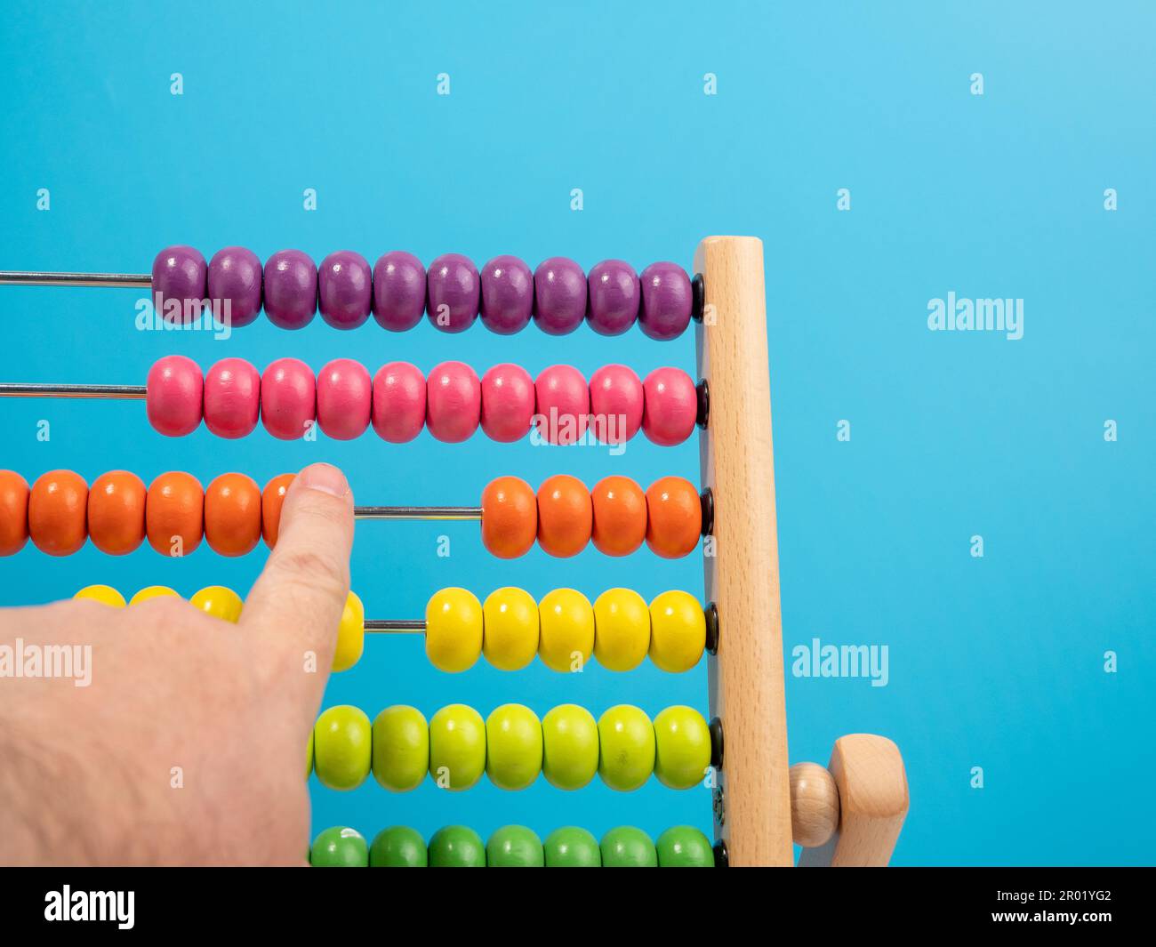 Wooden abacus on a blue background, Wooden abacus for children. Wooden ...