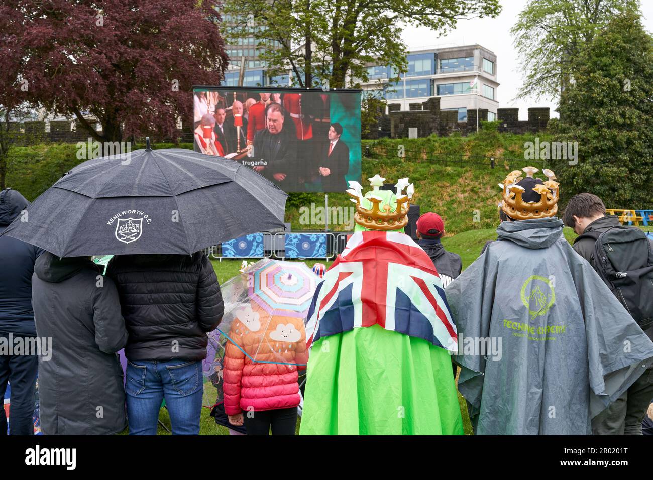 Crowd watching the coronation of Charles III on a big screen in the ...