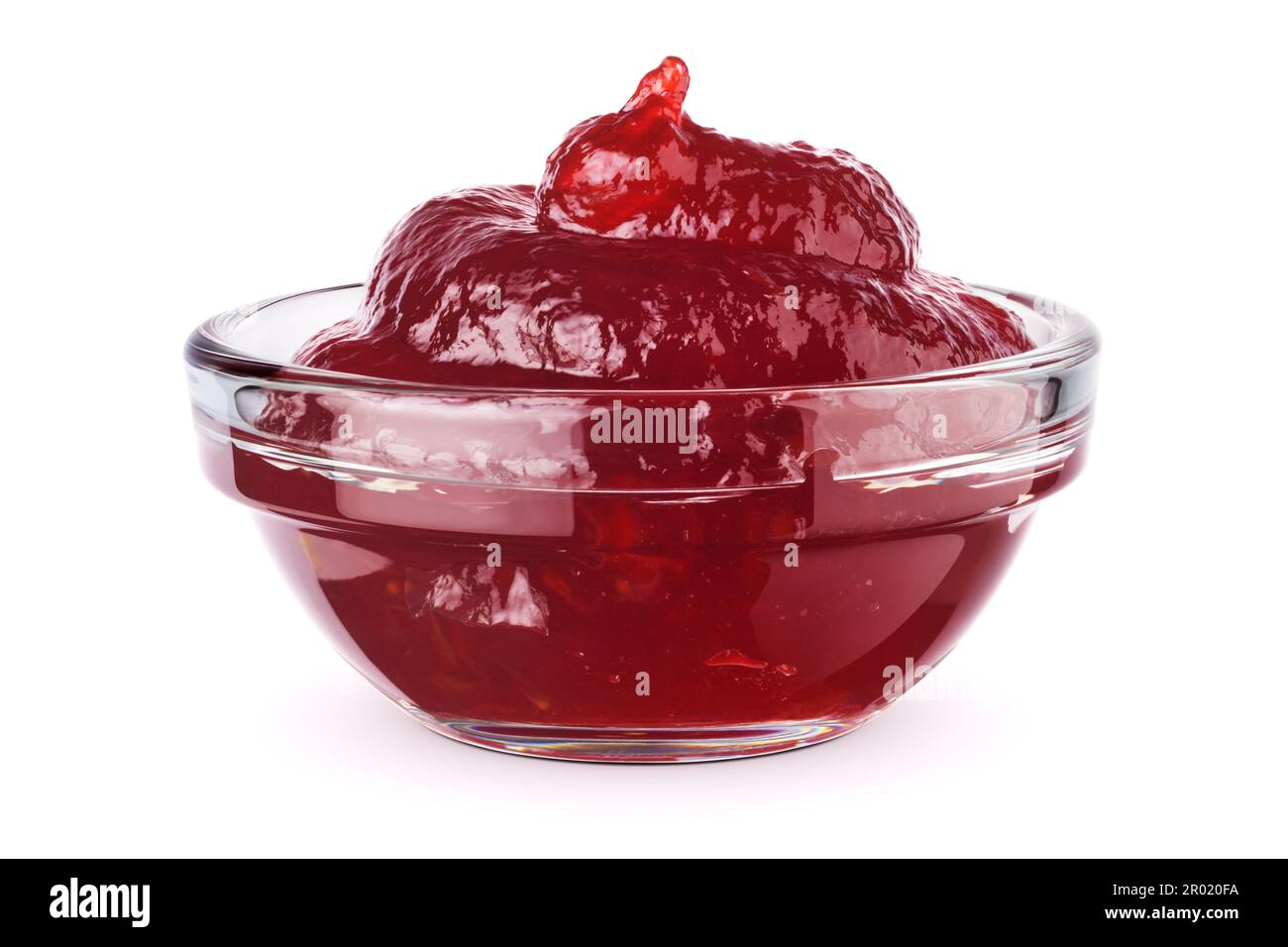 Glass bowl with red berry jam isolated on white background with ...