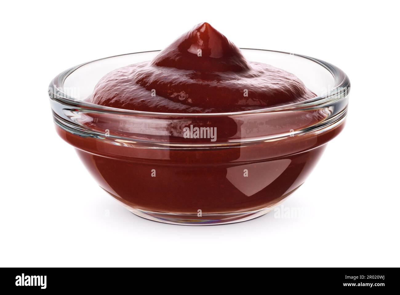 Barbecue sauce in glass transparent bowl, close-up. Isolated on white ...
