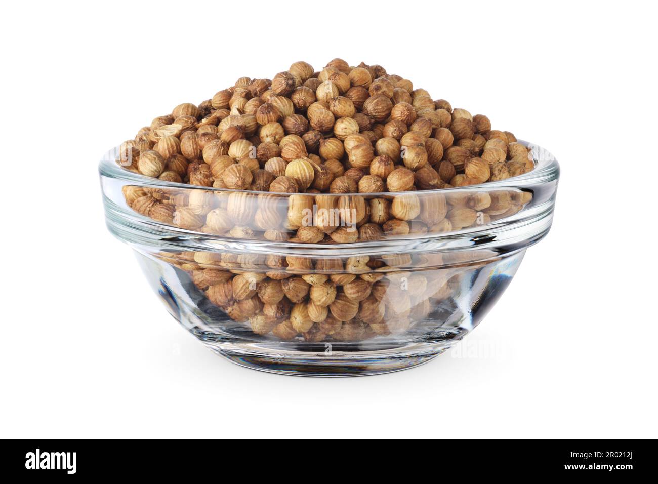 Whole dried coriander seeds in a glass bowl, isolated on white background Stock Photo - Alamy