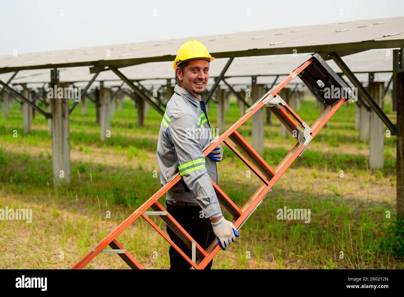 Maintenance technician checking solar panels on solar cell farm Stock ...