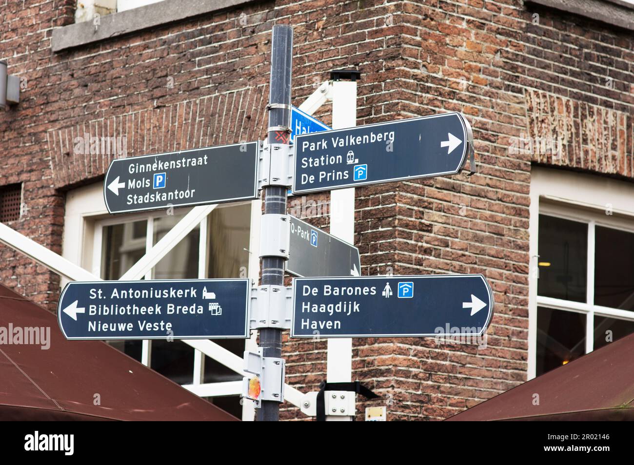 Pole with a blue signpost in the center of Breda in the Netherlands ...