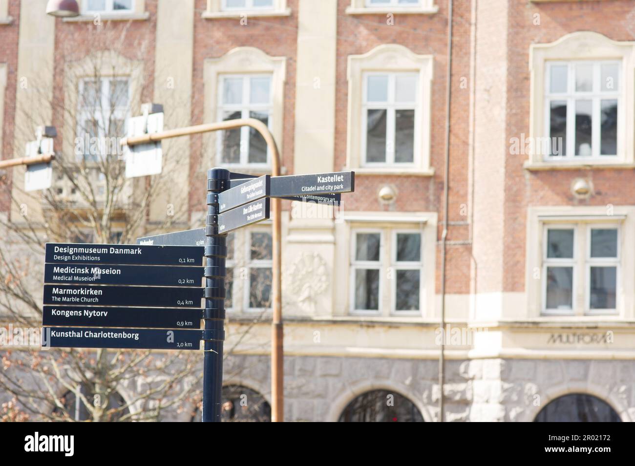 Copenhagen, Denmark - April 6, 2023: Pole with a blue signpost in the ...
