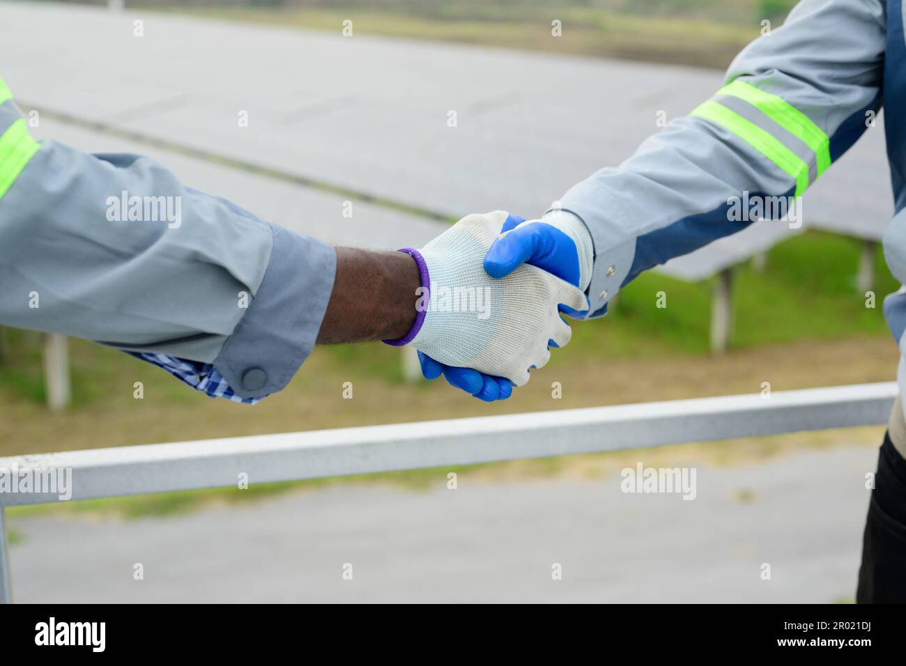 Maintenance engineers working with teamwork at ecological solar farm ...