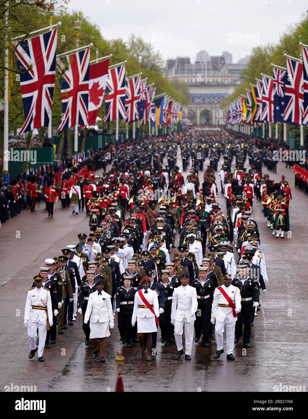 The Coronation Procession passes along The Mall to Buckingham Palace ...
