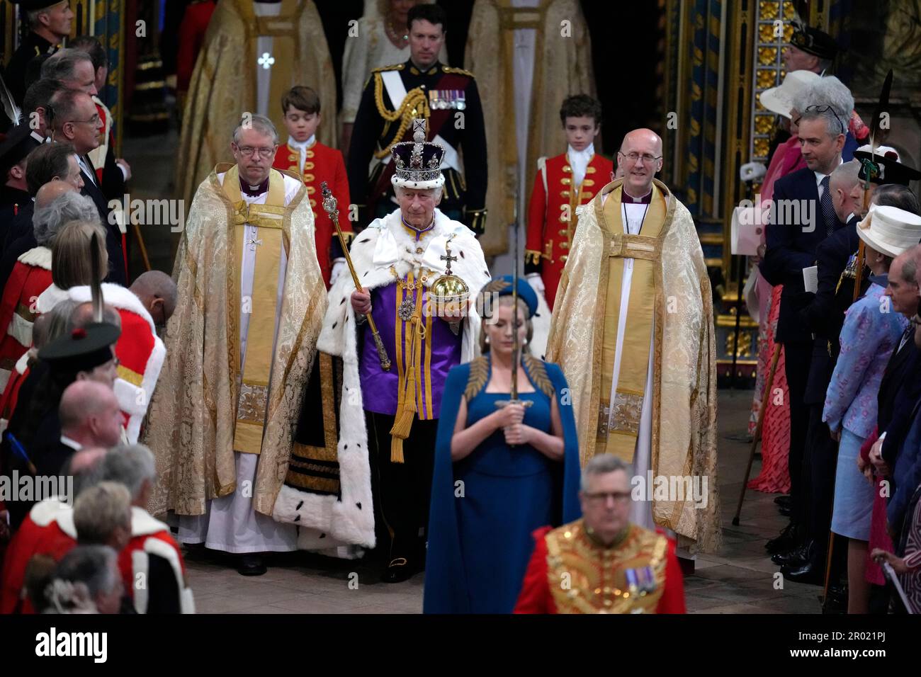Britain's King Charles III, center, walks in the Coronation Procession ...