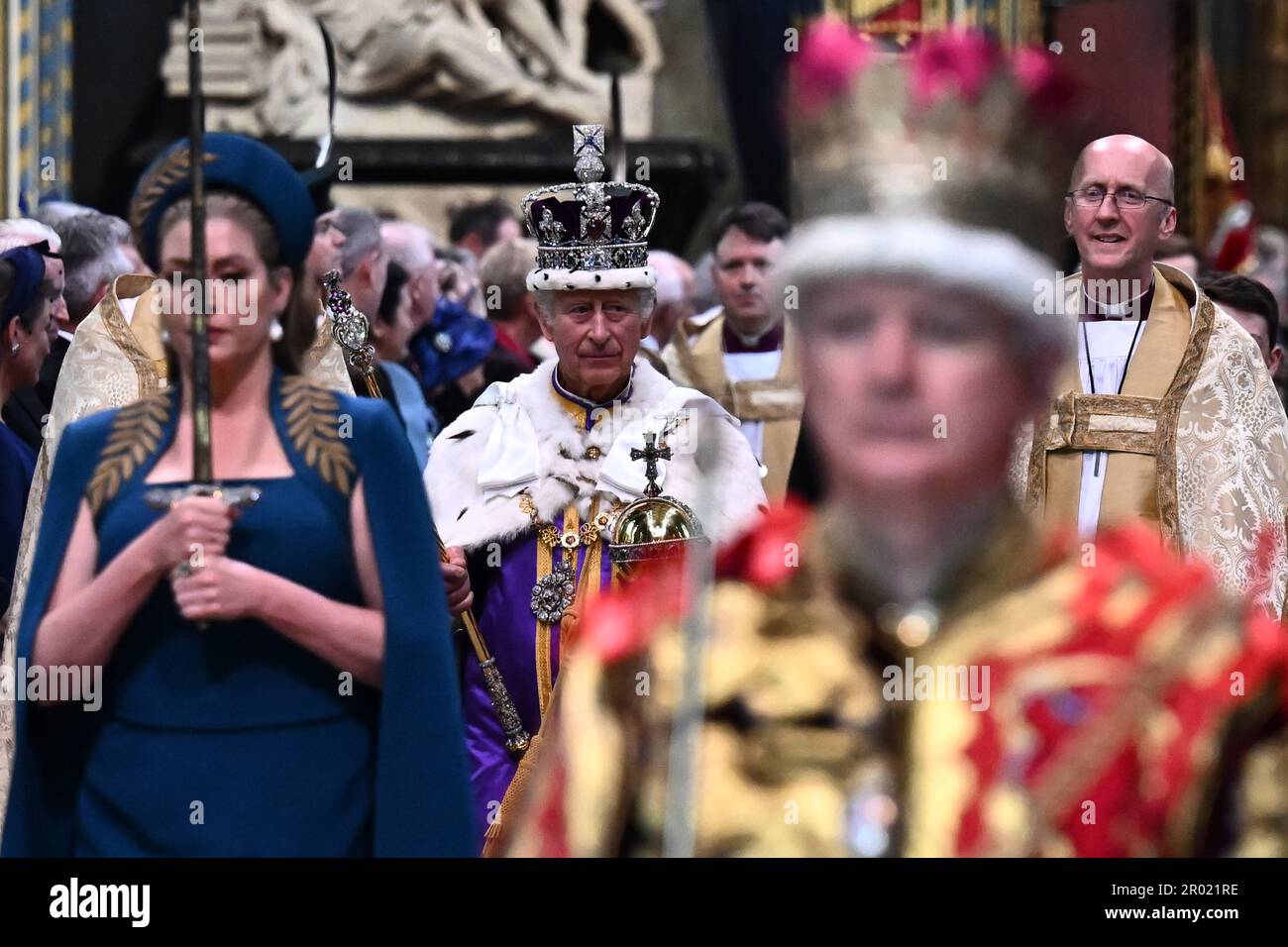 King Charles III wearing the Imperial state Crown carrying the ...