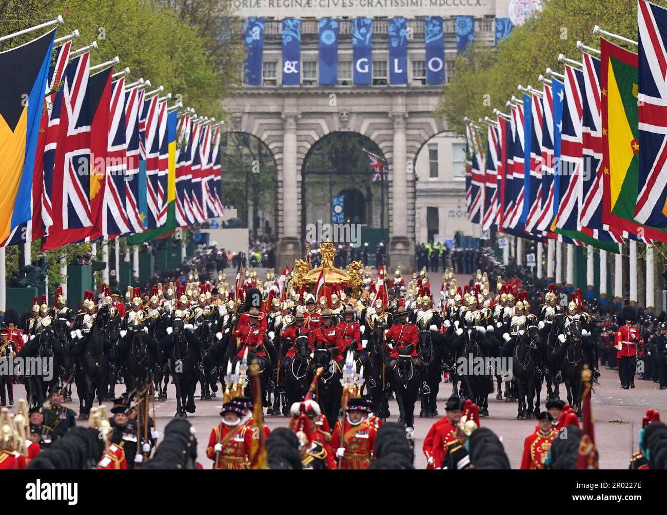 King Charles III and Queen Camilla are carried in the Gold State Coach ...
