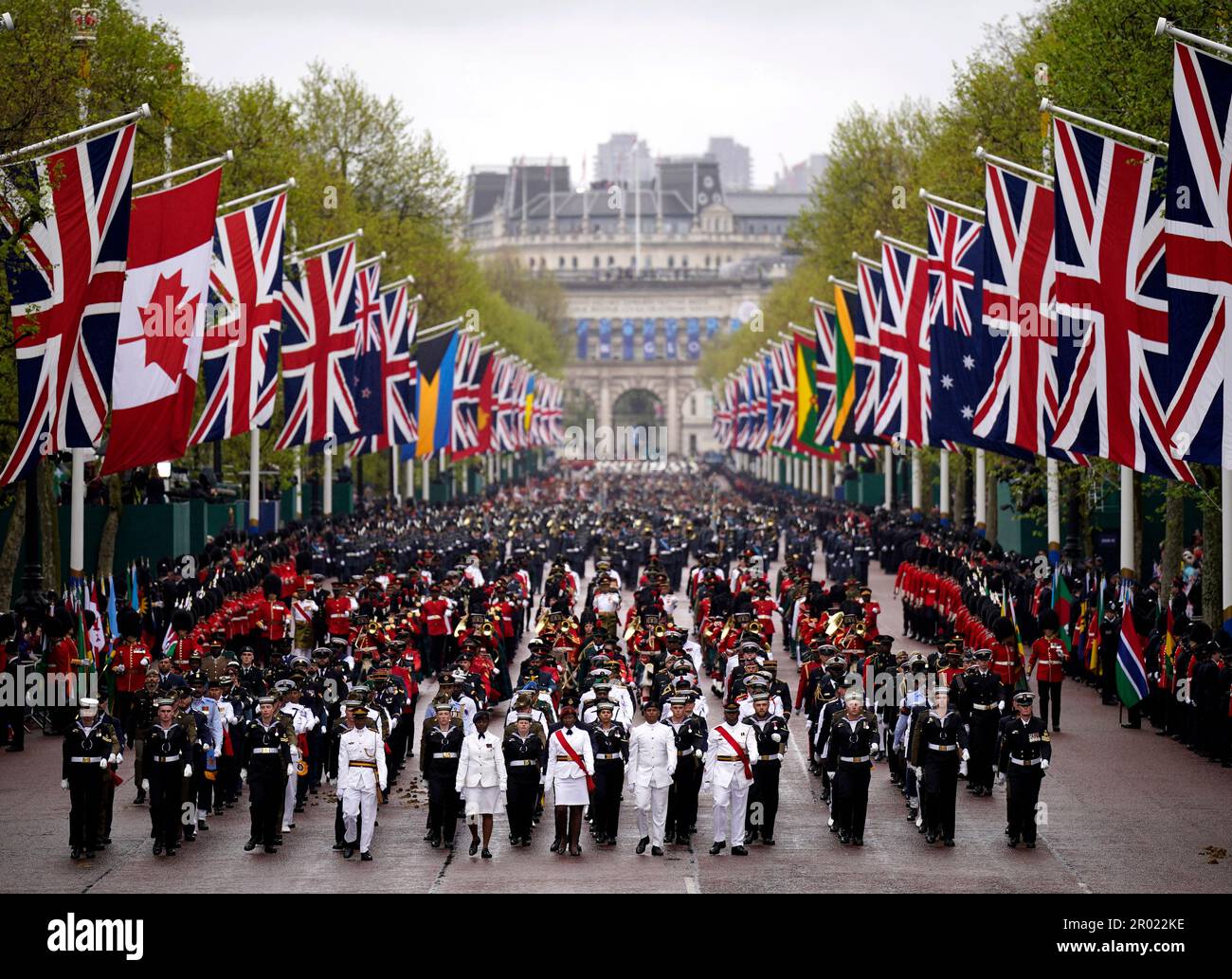 The Coronation Procession passes along The Mall to Buckingham Palace ...