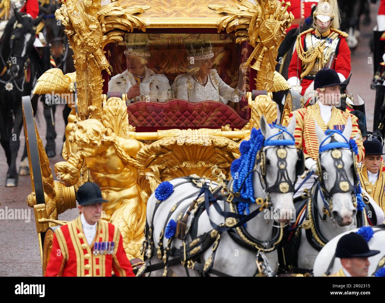 King Charles III and Queen Camilla are carried in the Gold State Coach ...