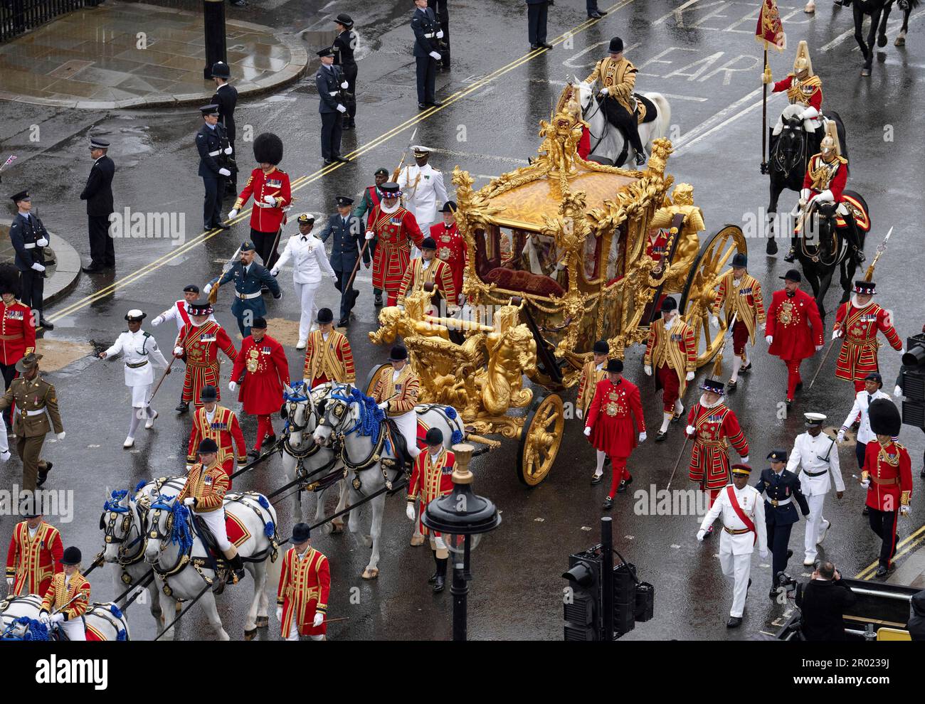 Britain's King Charles III and Queen Camilla travel in the Gold State ...