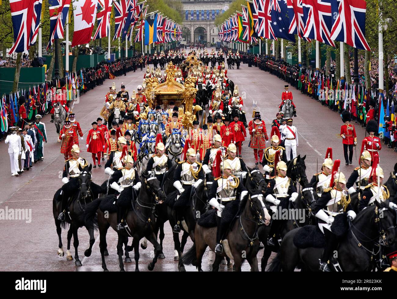 King Charles III and Queen Camilla are carried in the Gold State Coach ...