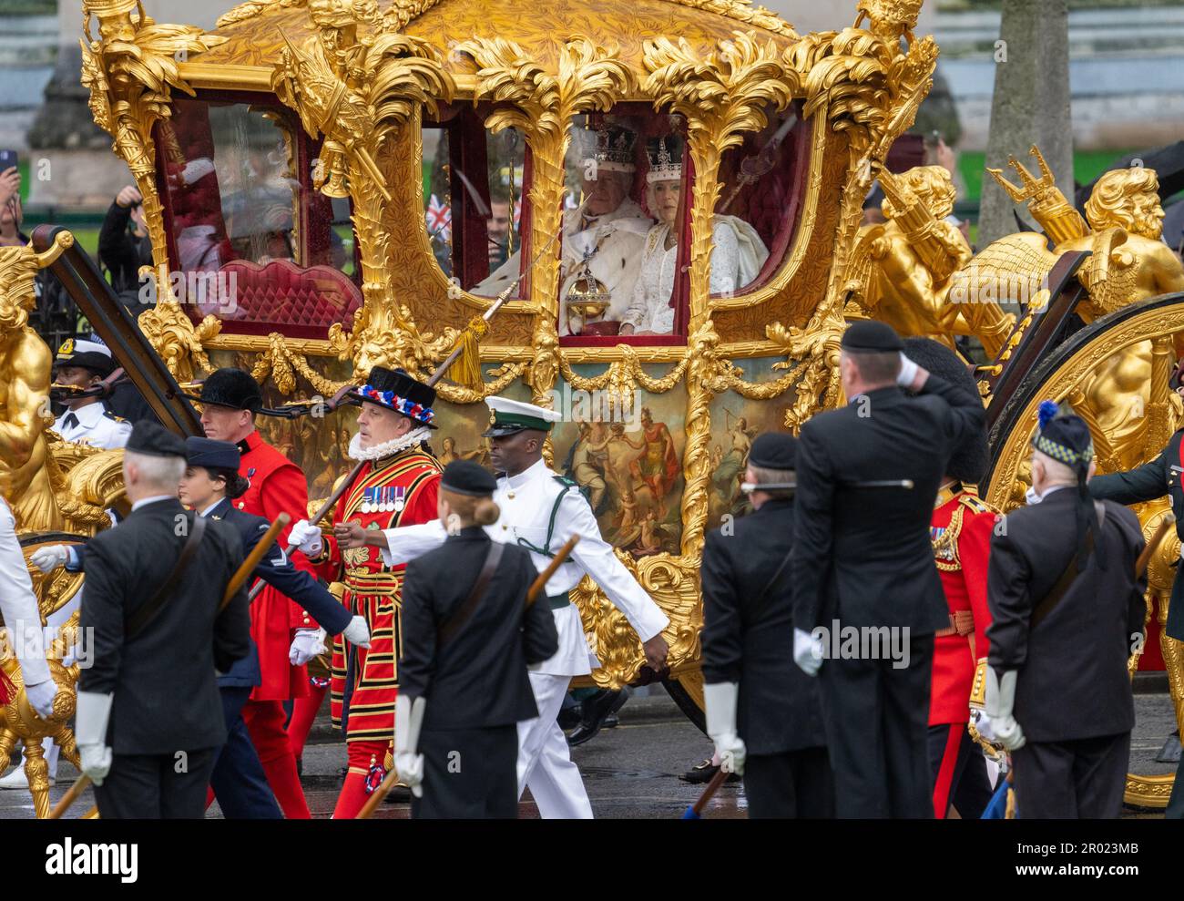King Charles III and Queen Camilla are carried in the Gold State Coach ...