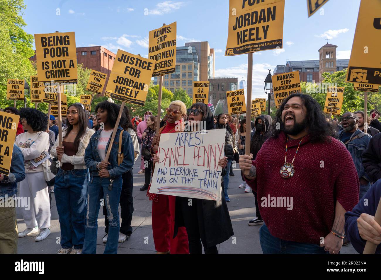 Protesters hold placards expressing their opinions at a "Justice for ...