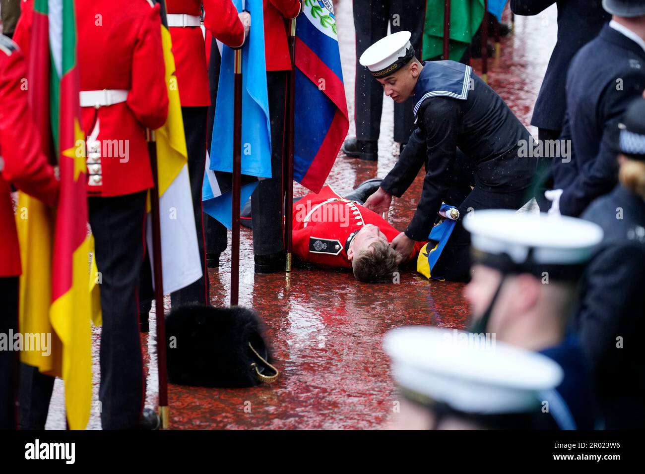 A flag bearer collapsed during a procession following coronation ...