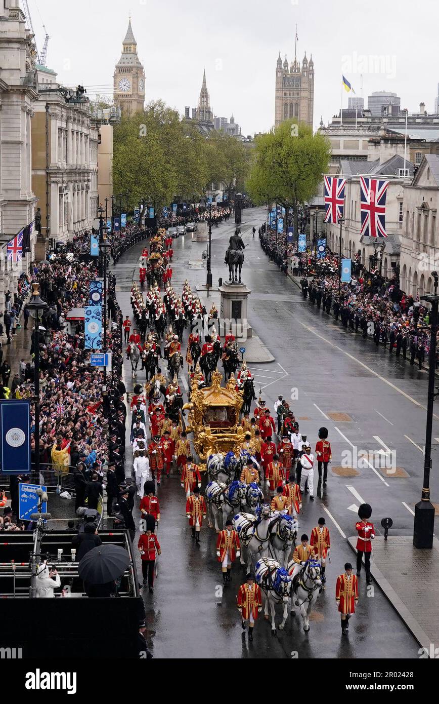 King Charles III and Queen Camilla are carried in the Gold State Coach ...