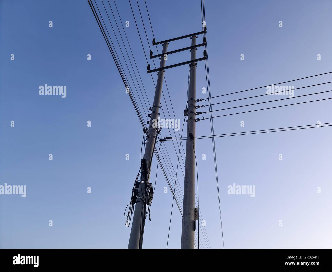 Wildly attached power cables to a power pole Stock Photo - Alamy