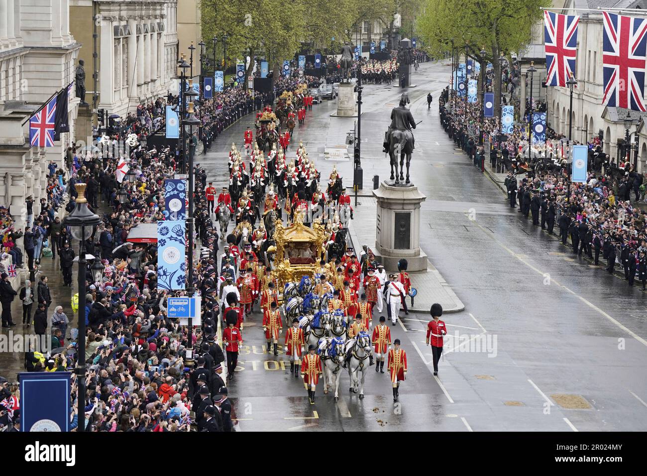 King Charles III and Queen Camilla are carried in the Gold State Coach ...