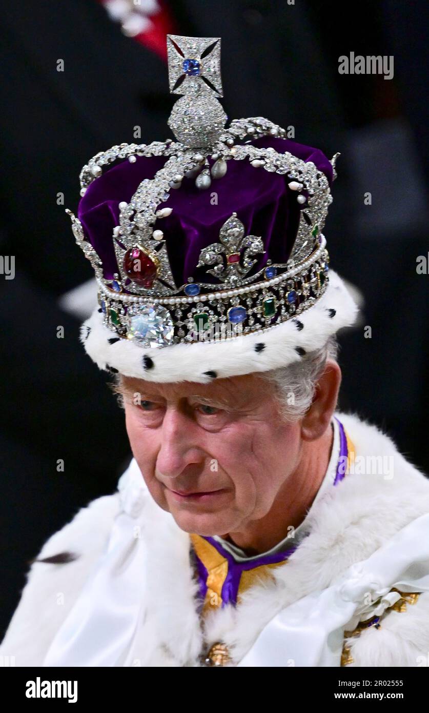 Britain's King Charles III wears the Imperial State Crown as he leaves ...