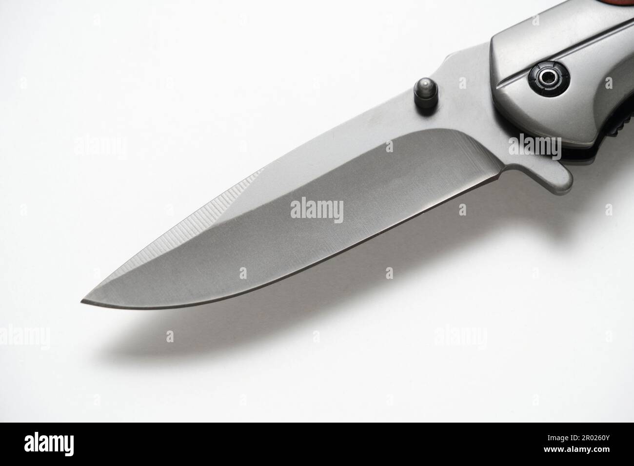 Folding knife blade white background Stock Photo - Alamy