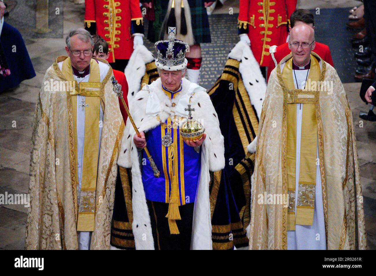 King Charles III, wearing the Imperial State Crown, leaves Westminster ...