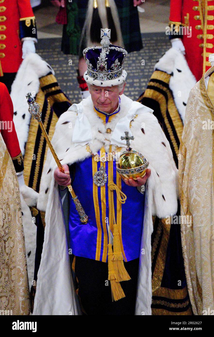 King Charles III, wearing the Imperial State Crown, leaves Westminster ...