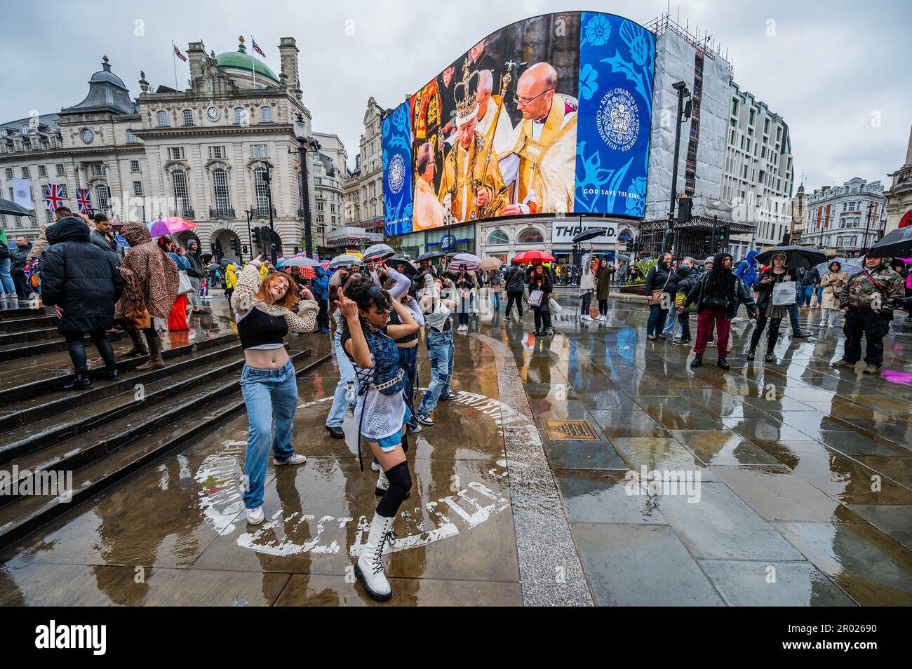 London, UK. 6th May, 2023. A dance troop strangely chooses this day to ...