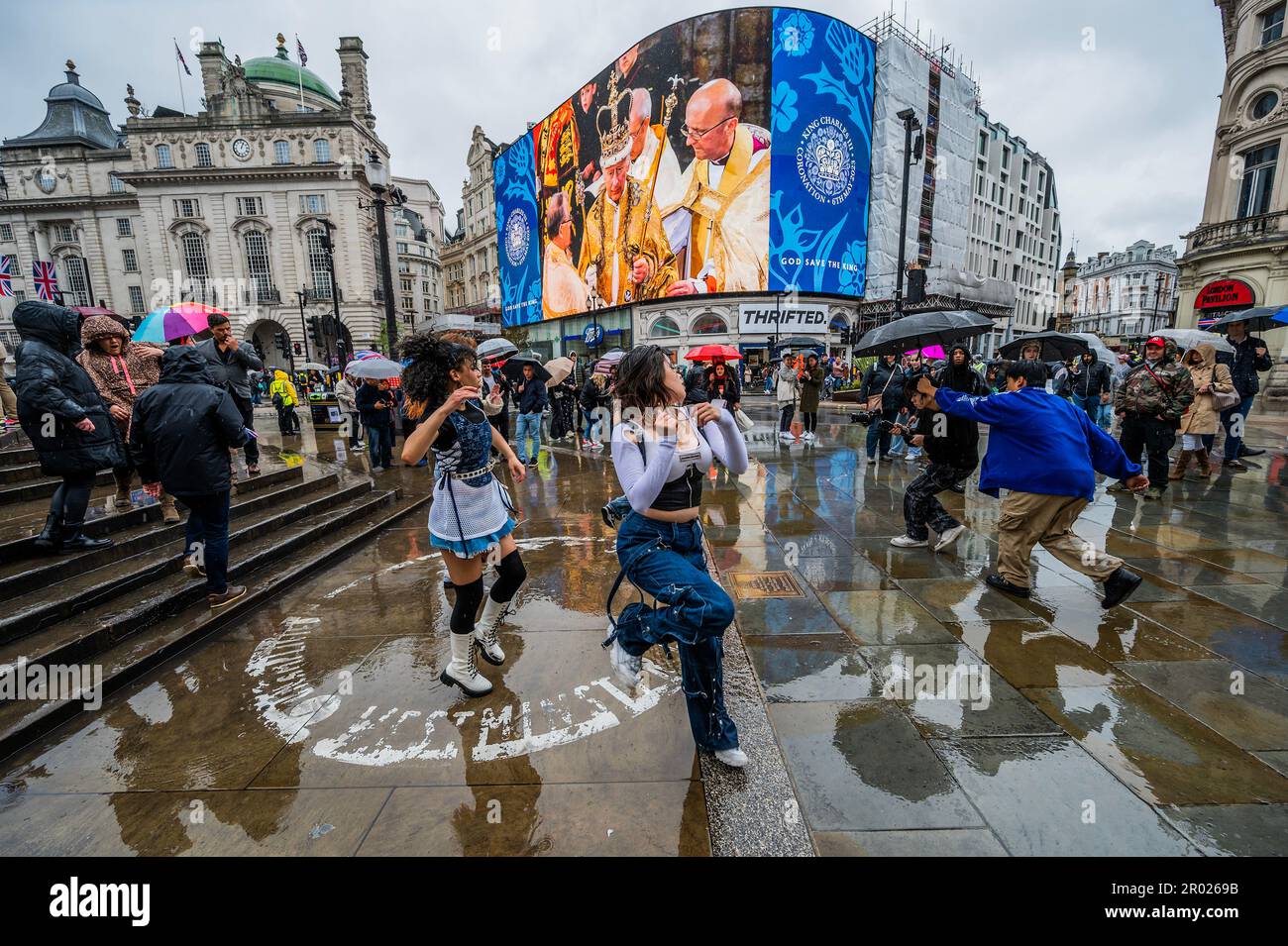 London, UK. 6th May, 2023. A dance troop strangely chooses this day to ...
