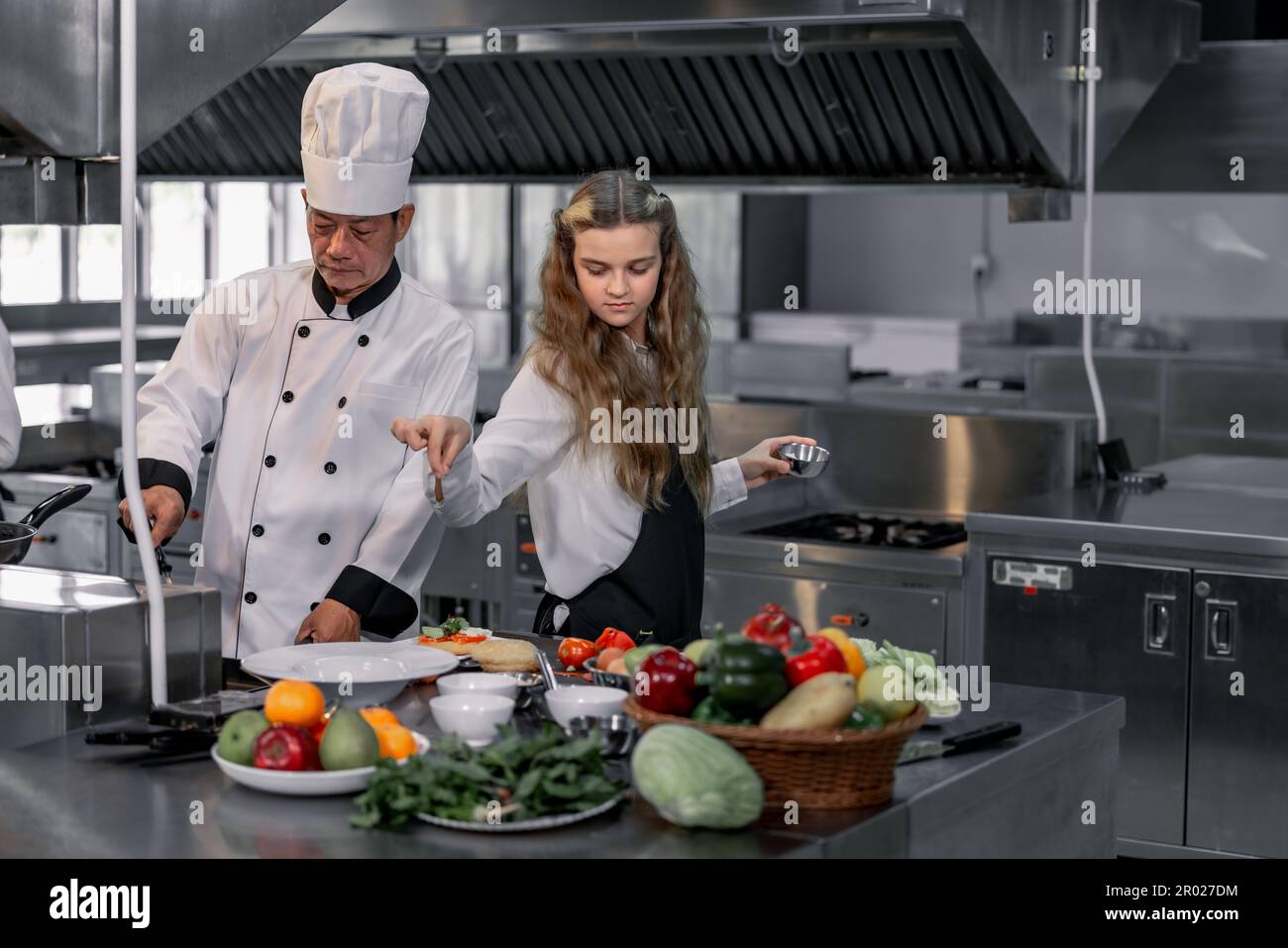 Teenagers learn from expert chefs at culinary school to prepare ...