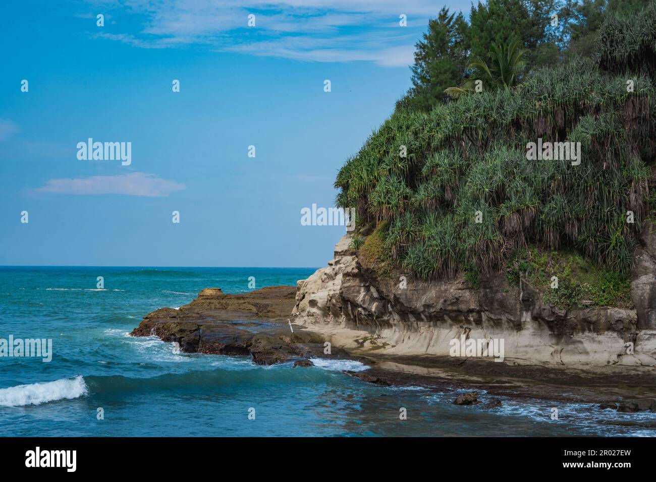 Pantai Klayar or Klayar Beach with rocks and strong waves against the ...