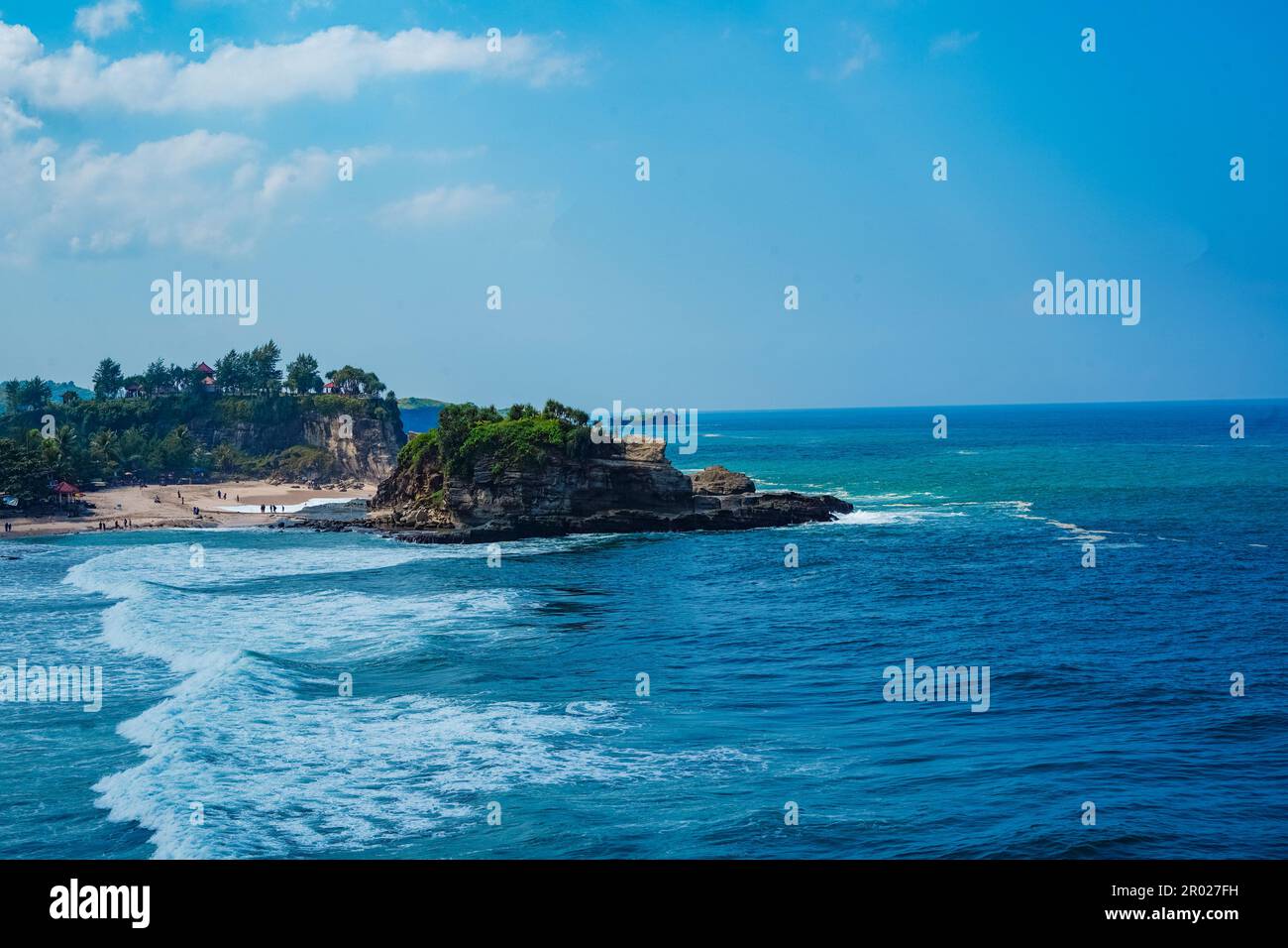 Pantai Klayar or Klayar Beach with rocks and strong waves against the ...