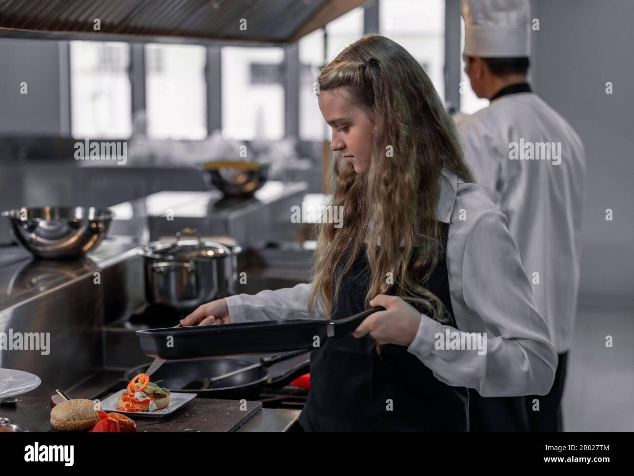 Teenagers learn from expert chefs at culinary school to prepare ...