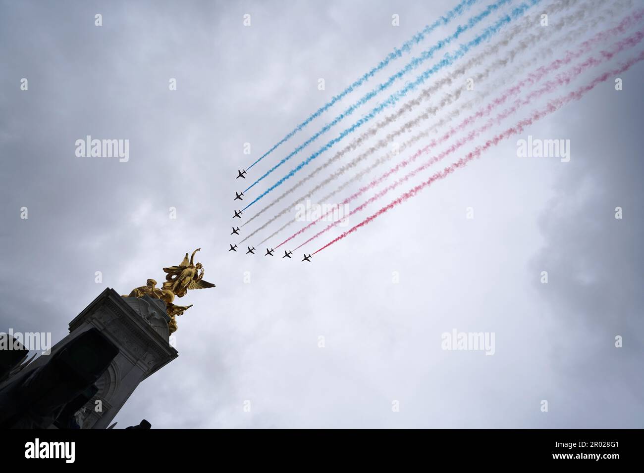 A general view of flypast by aircraft from the Red Arrows over the Mall ...