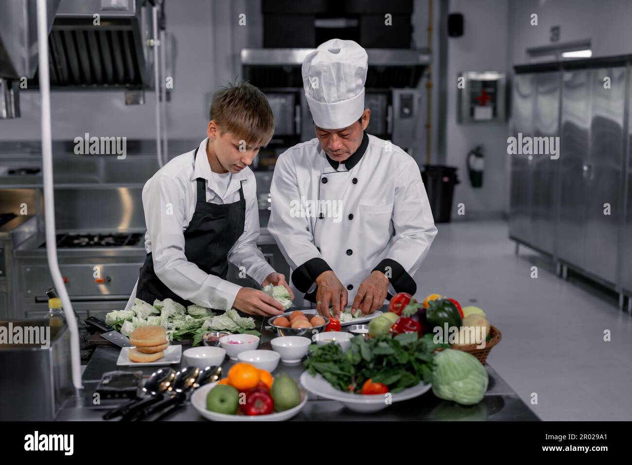 Teenagers learn from expert chefs at culinary school to prepare ...