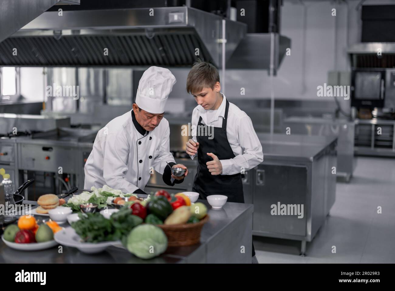 Teenagers learn from expert chefs at culinary school to prepare ...