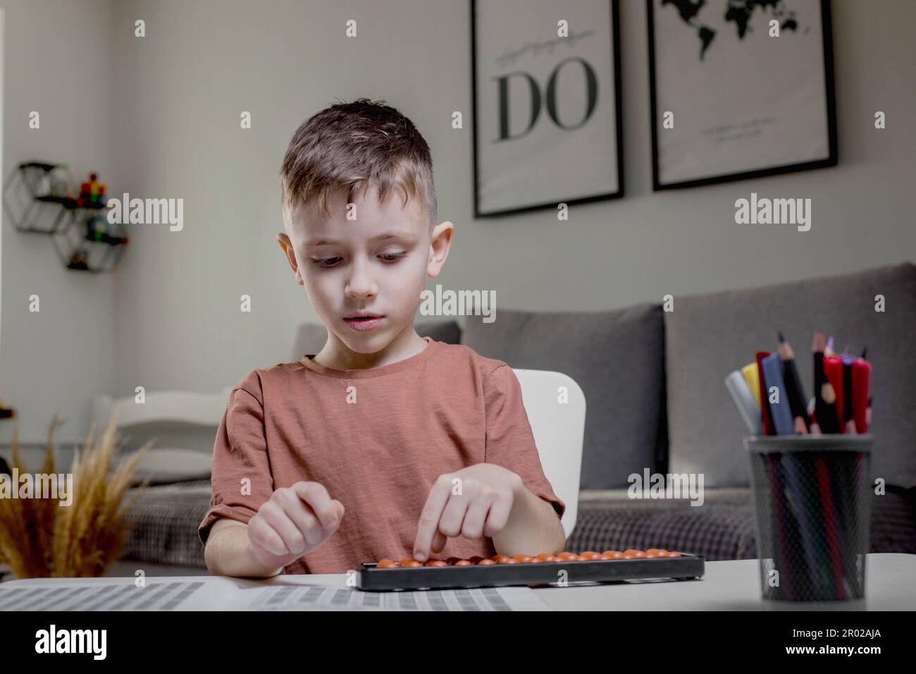 Little boy Counting with help an abacus. Mental arithmetic, brain ...