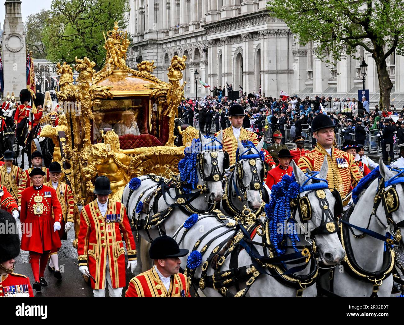 King Charles III and Queen Camilla ride in their carriage along ...