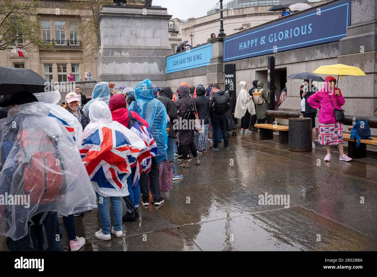Beneath the banner proclaiming 'Happy And Glorious', members of the ...