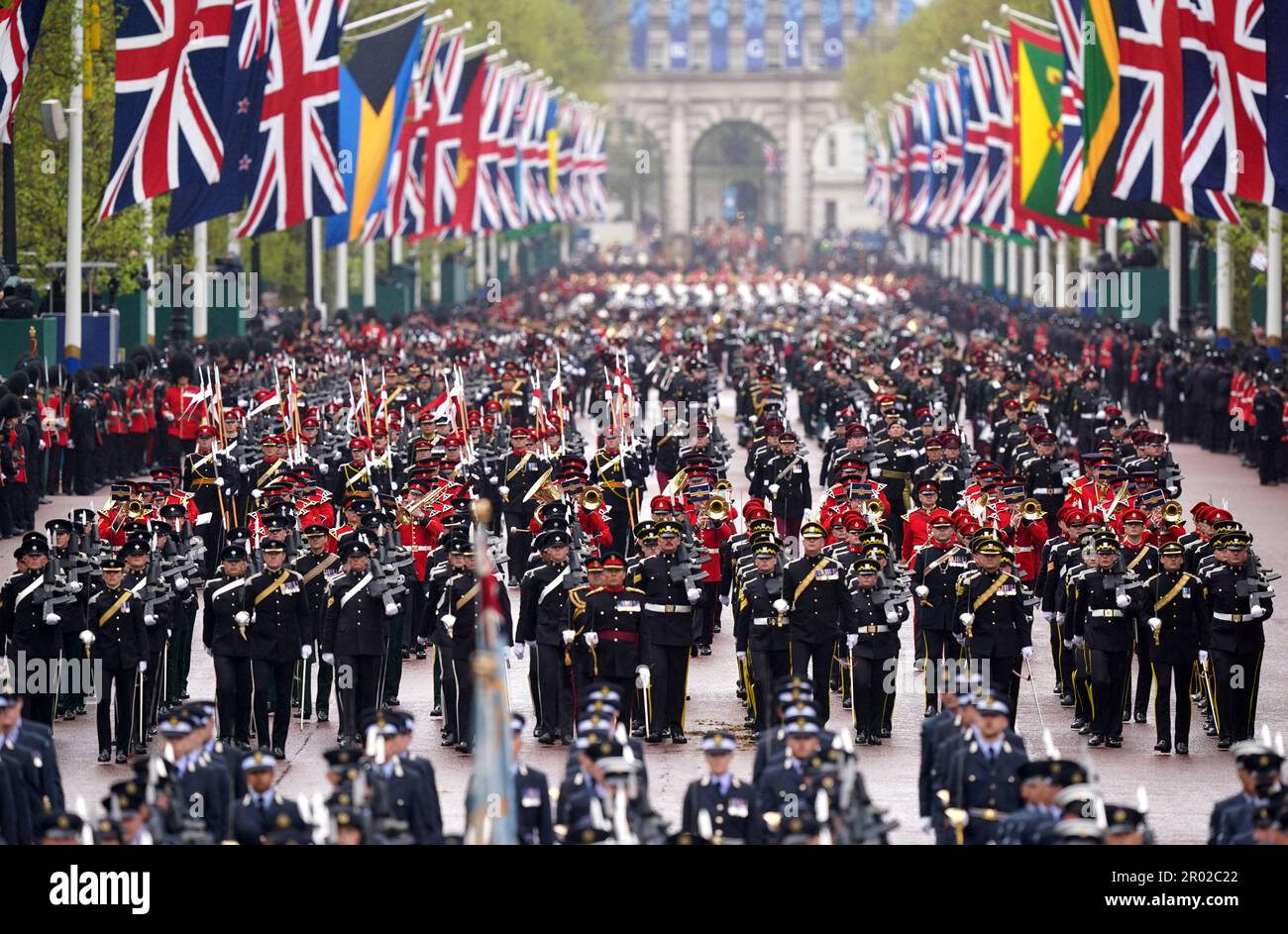 The Coronation Procession passes along The Mall to Buckingham Palace ...