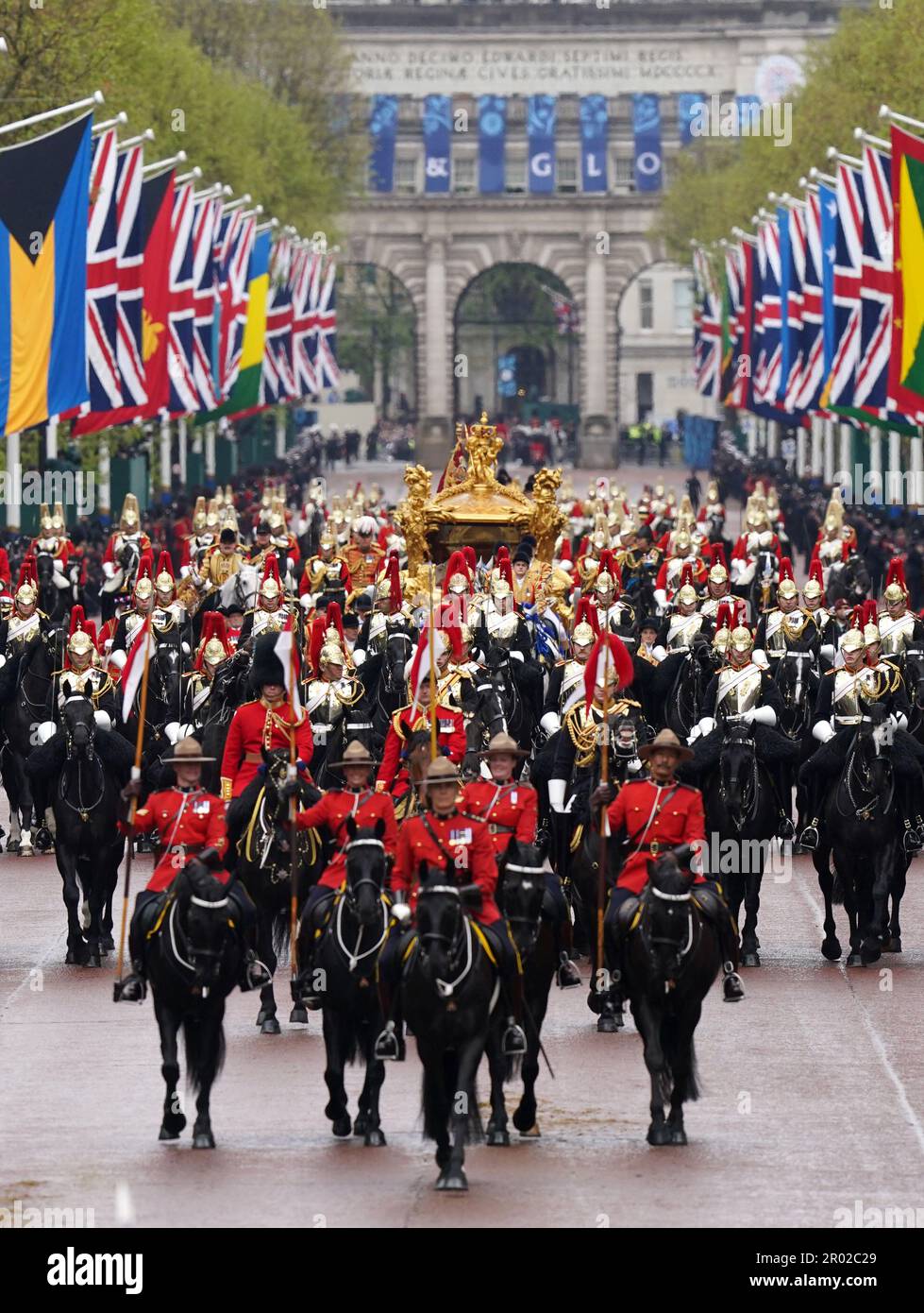 King Charles III and Queen Camilla are carried in the Gold State Coach ...