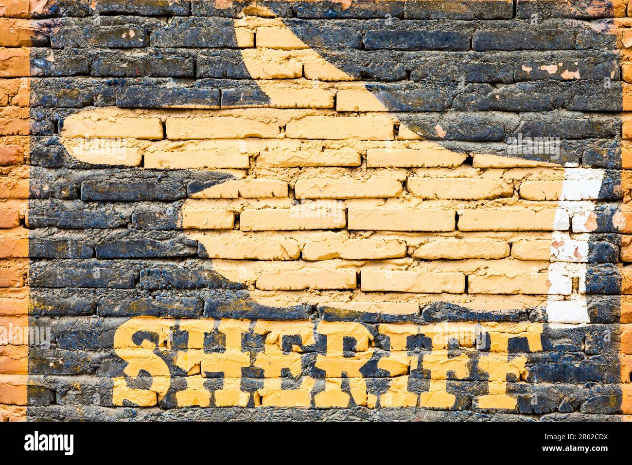 Sheriff graffiti on an old brick wall. Concept for security Stock Photo ...