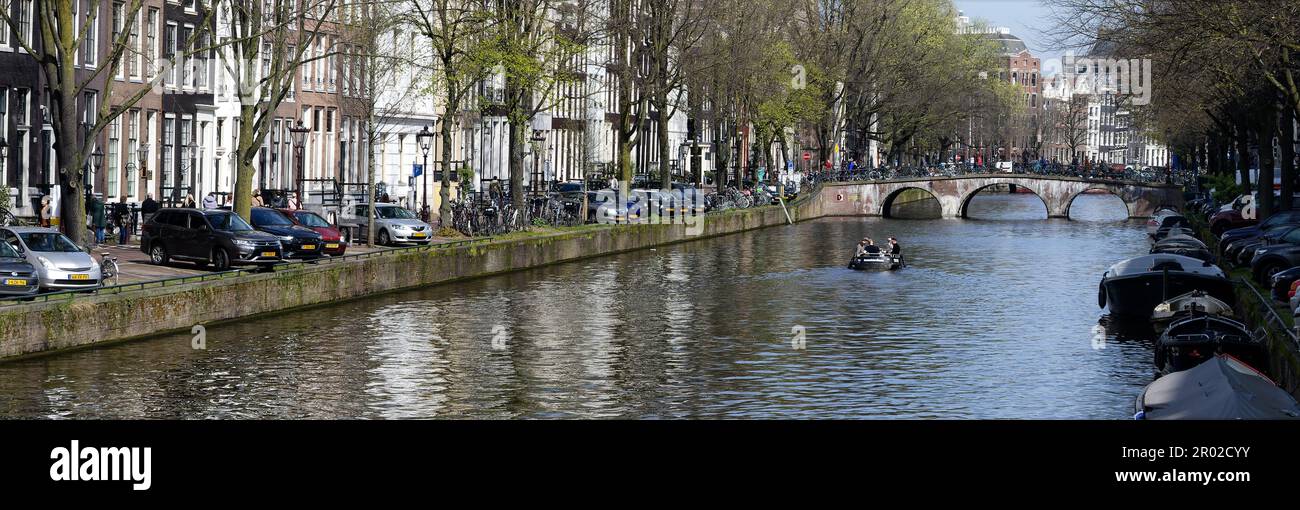 Wide panoramic of the iconic canals and bridges of Amsterdam, Holland ...