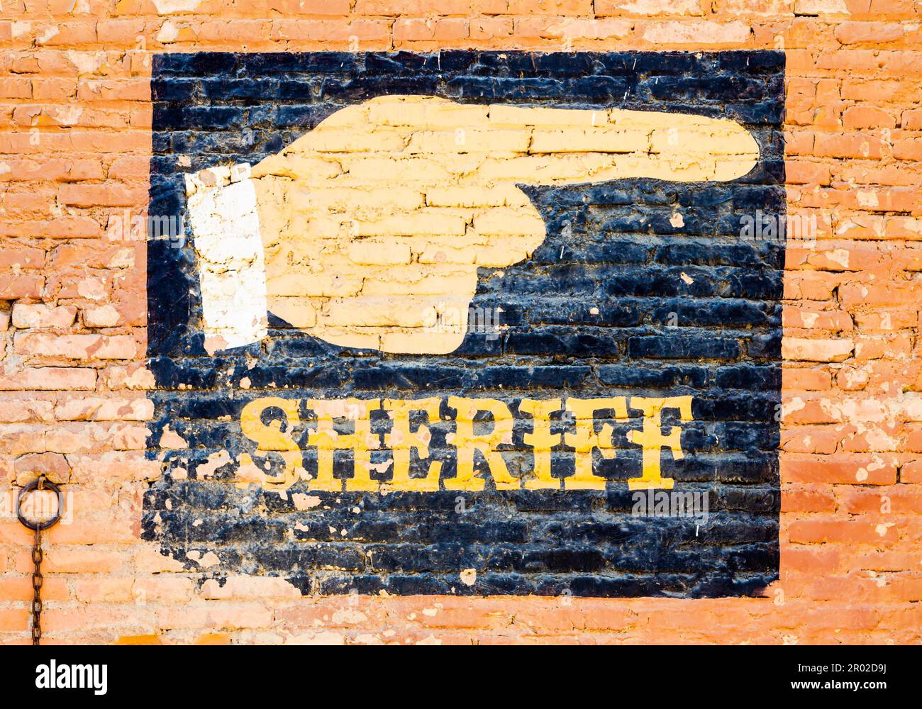 Sheriff graffiti on an old brick wall. Concept for security Stock Photo ...