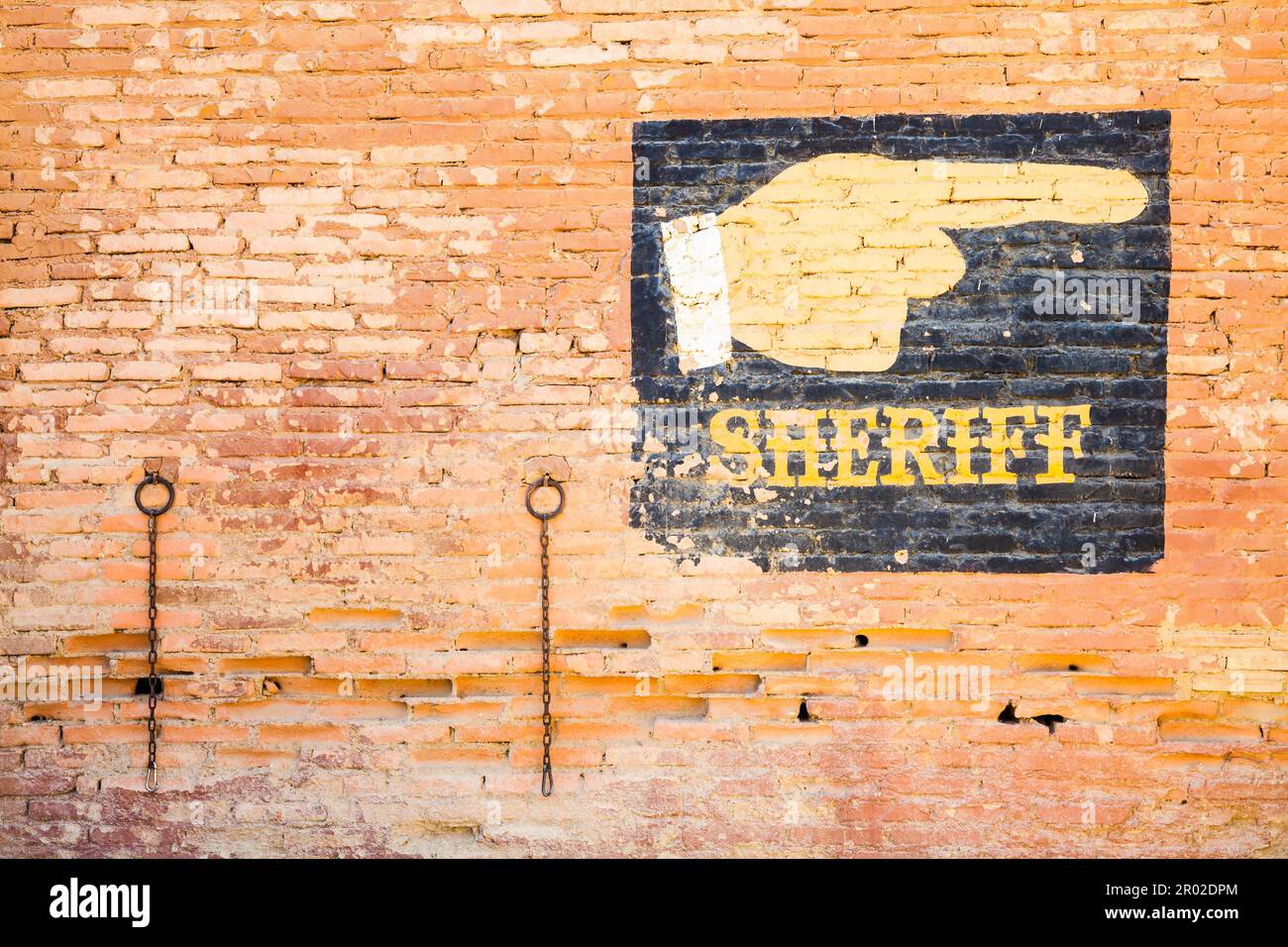 Sheriff graffiti on an old brick wall. Concept for security Stock Photo ...
