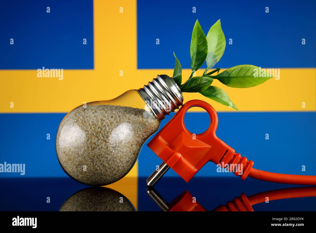 Plug, plant growing inside the light bulb and Sweden Flag. Green eco ...