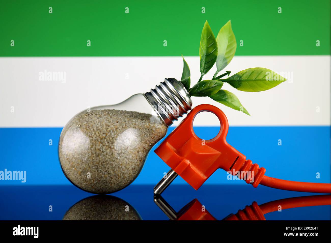Plug, plant growing inside the light bulb and Sierra Leone Flag. Green ...