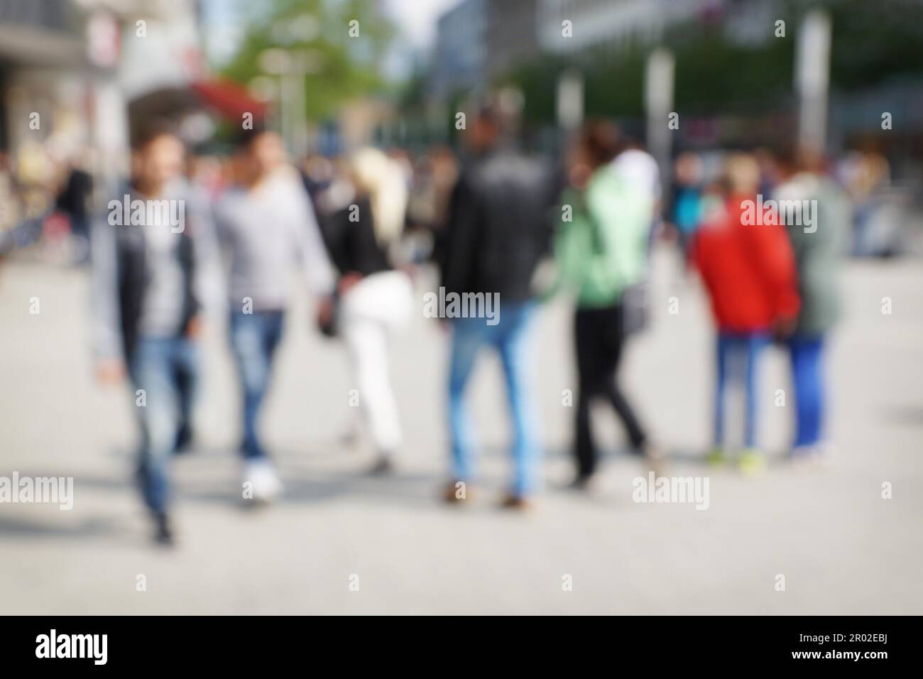 out of focus group of people walking through pedestrian area Stock ...