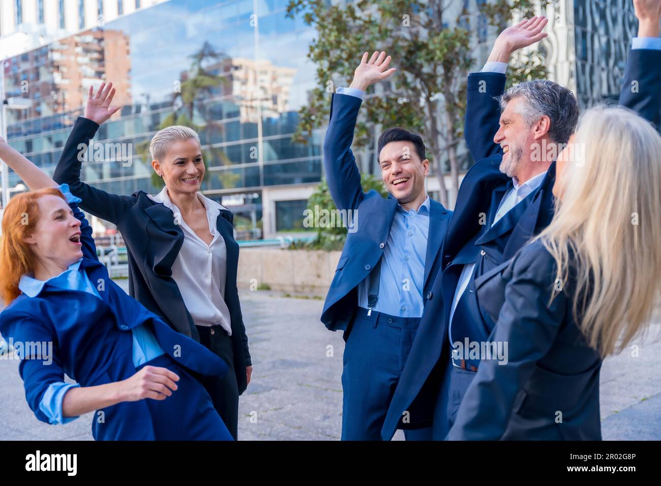 Senior Executives Encourage Each Other with High-Five in Teamwork and ...