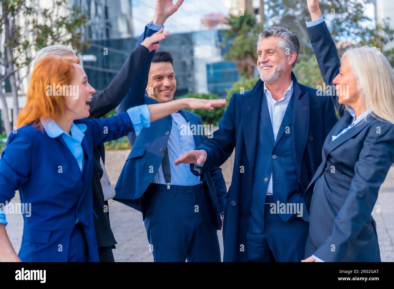 Senior Executives with Positive Attitude High-Five to Mark Achievement ...
